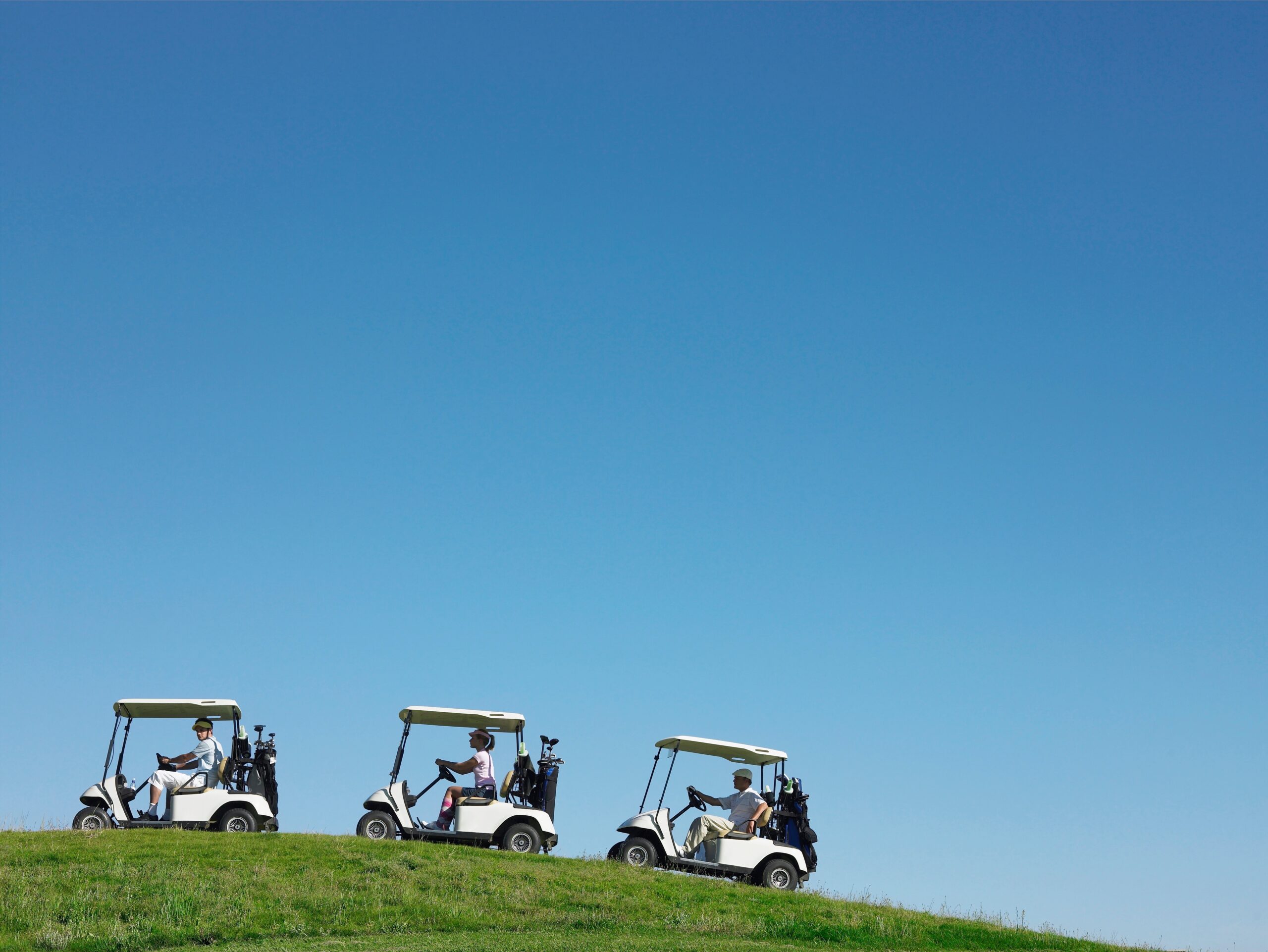Golfers Driving Carts - Golf Connecting